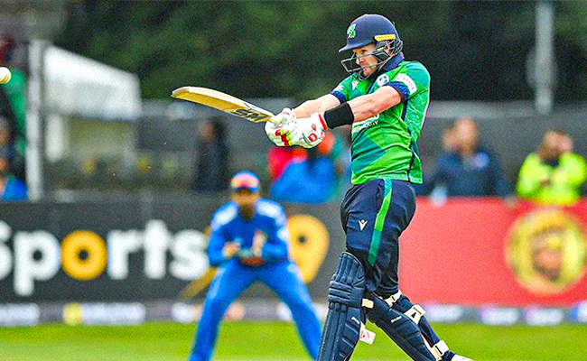 Barry McCarthy scripts a unique record in T20Is against India - Sakshi