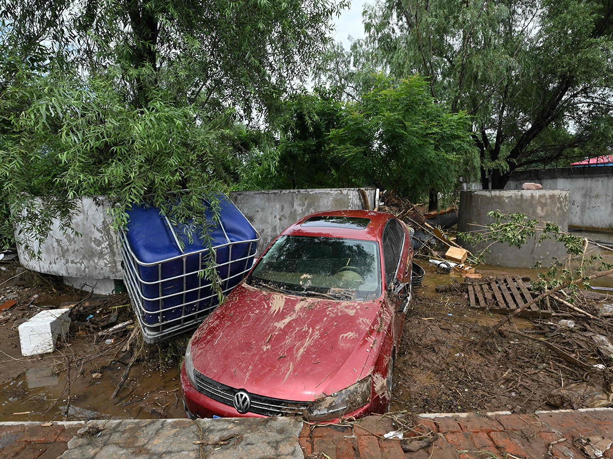 వరద బీభత్సం..చైనా అతలాకుతలం (ఫొటోలు) | Heavy Floods In China Photos ...